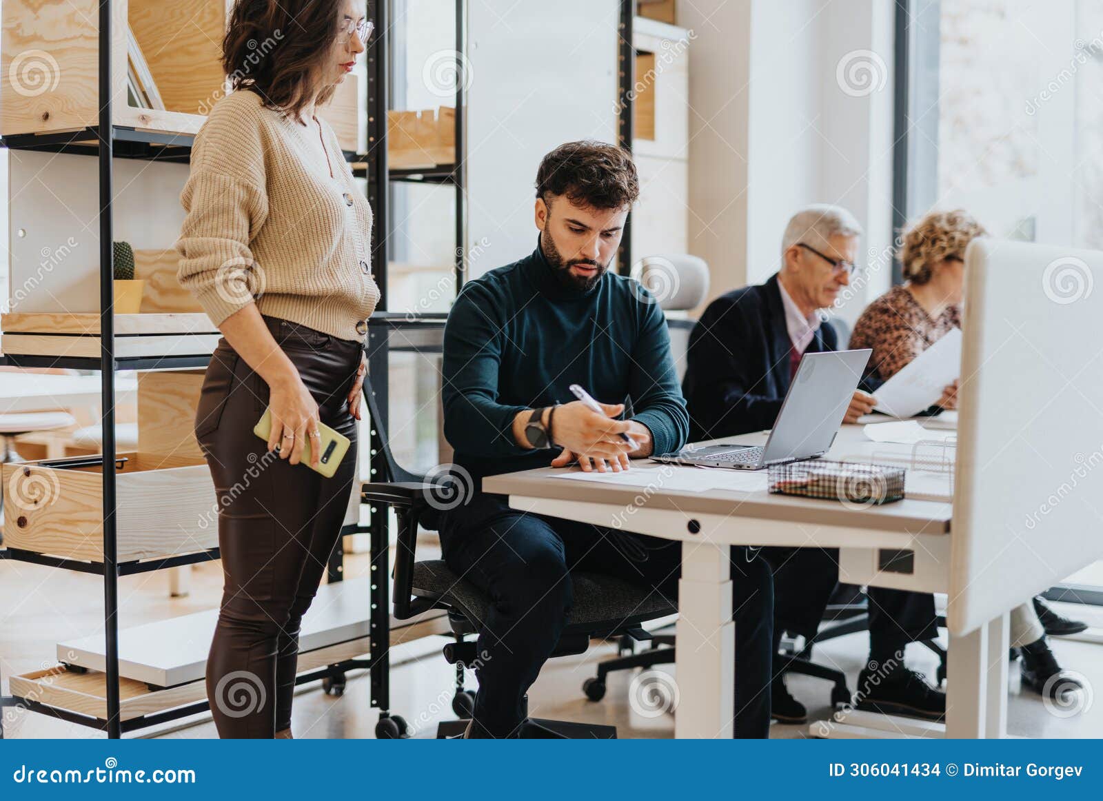 Diverse Group of Happy Coworkers Collaborating on Projects in Modern ...
