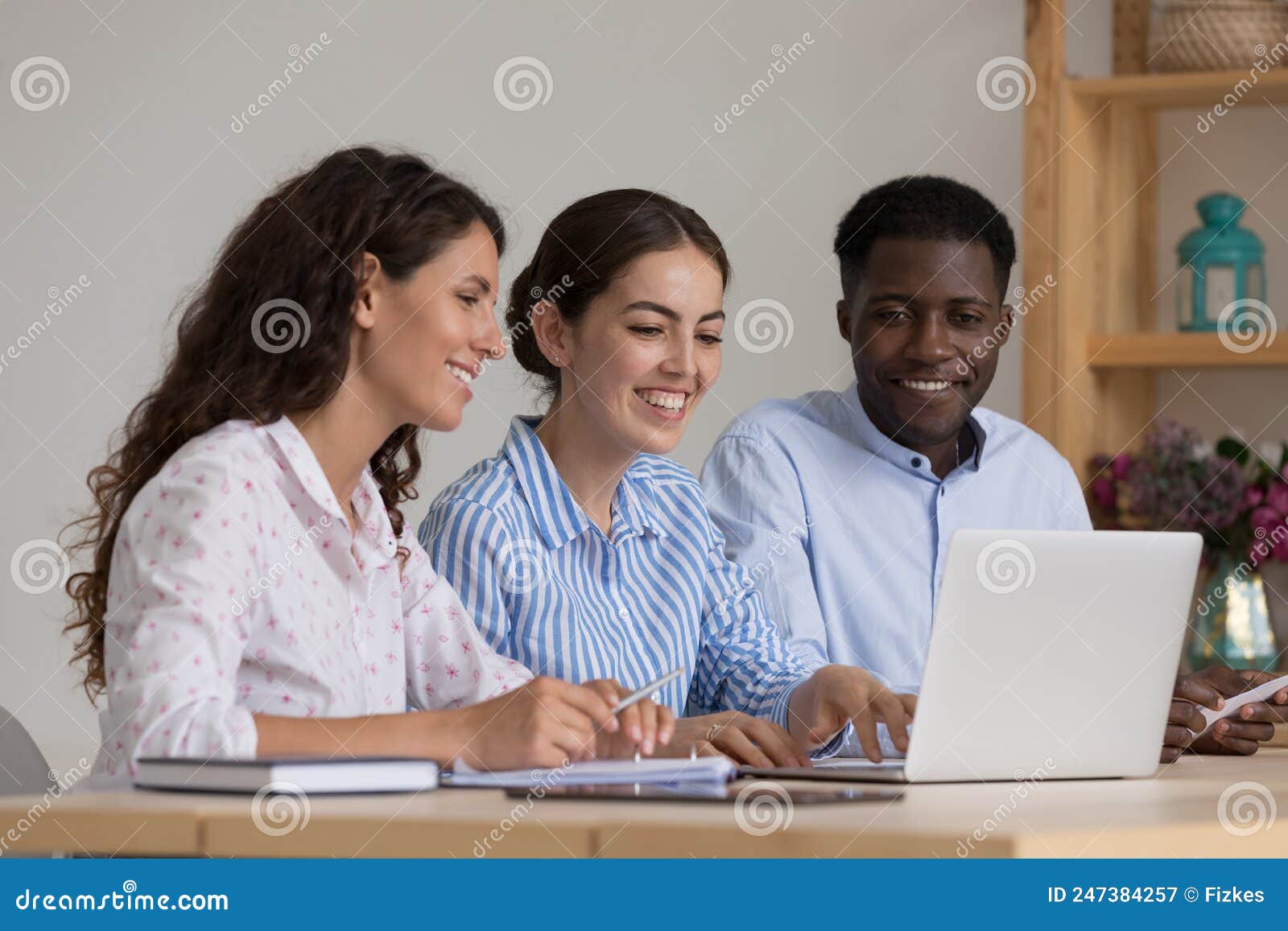 Diverse Group of Happy Interns and Mentor Talking at Laptop Stock Image ...