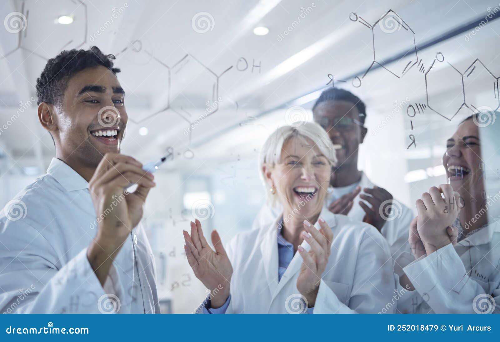 Diverse Group of Happy Scientists Clapping Hands while Writing and ...