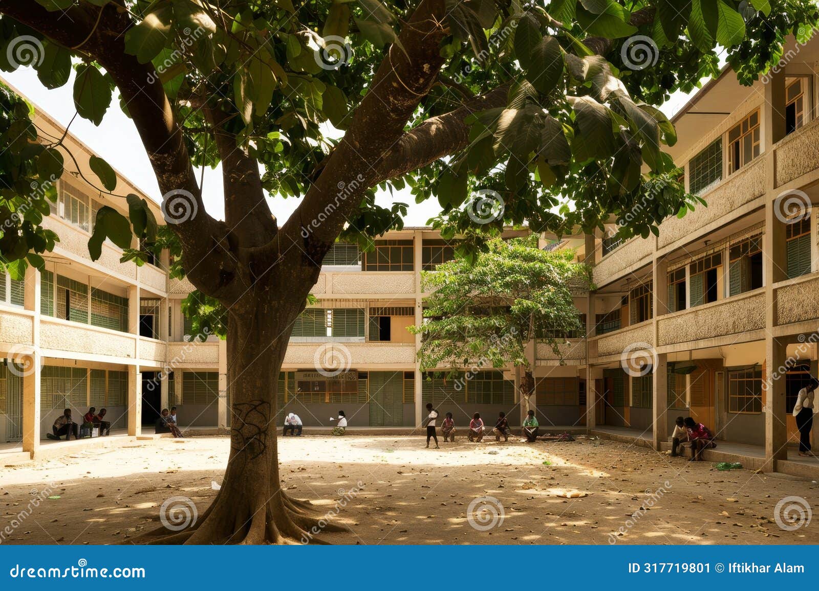 A Diverse Group of Individuals Sitting Around a Tree in a School ...