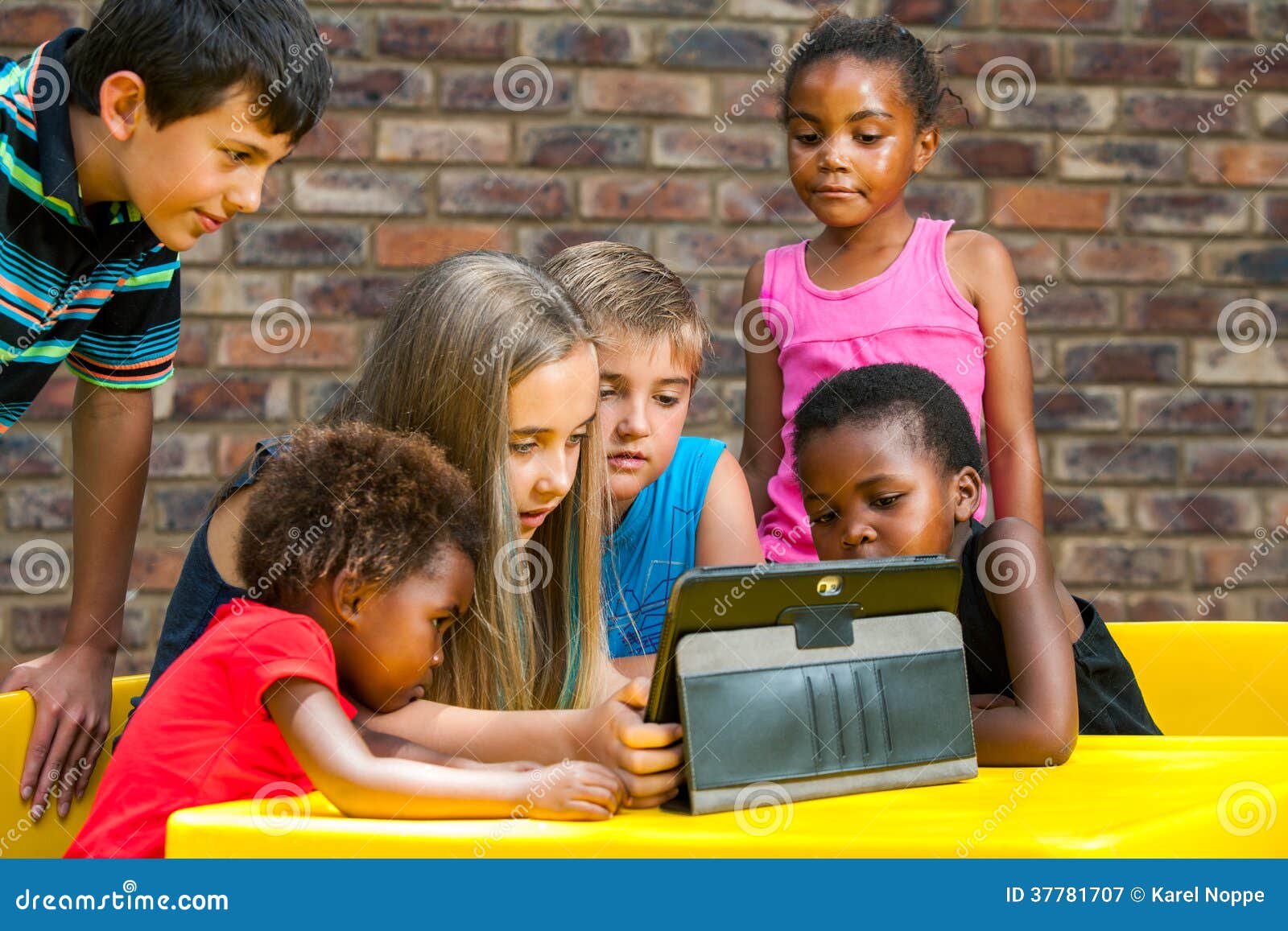 Diverse Group of Kids Looking at Tablet. Stock Image - Image of girls ...