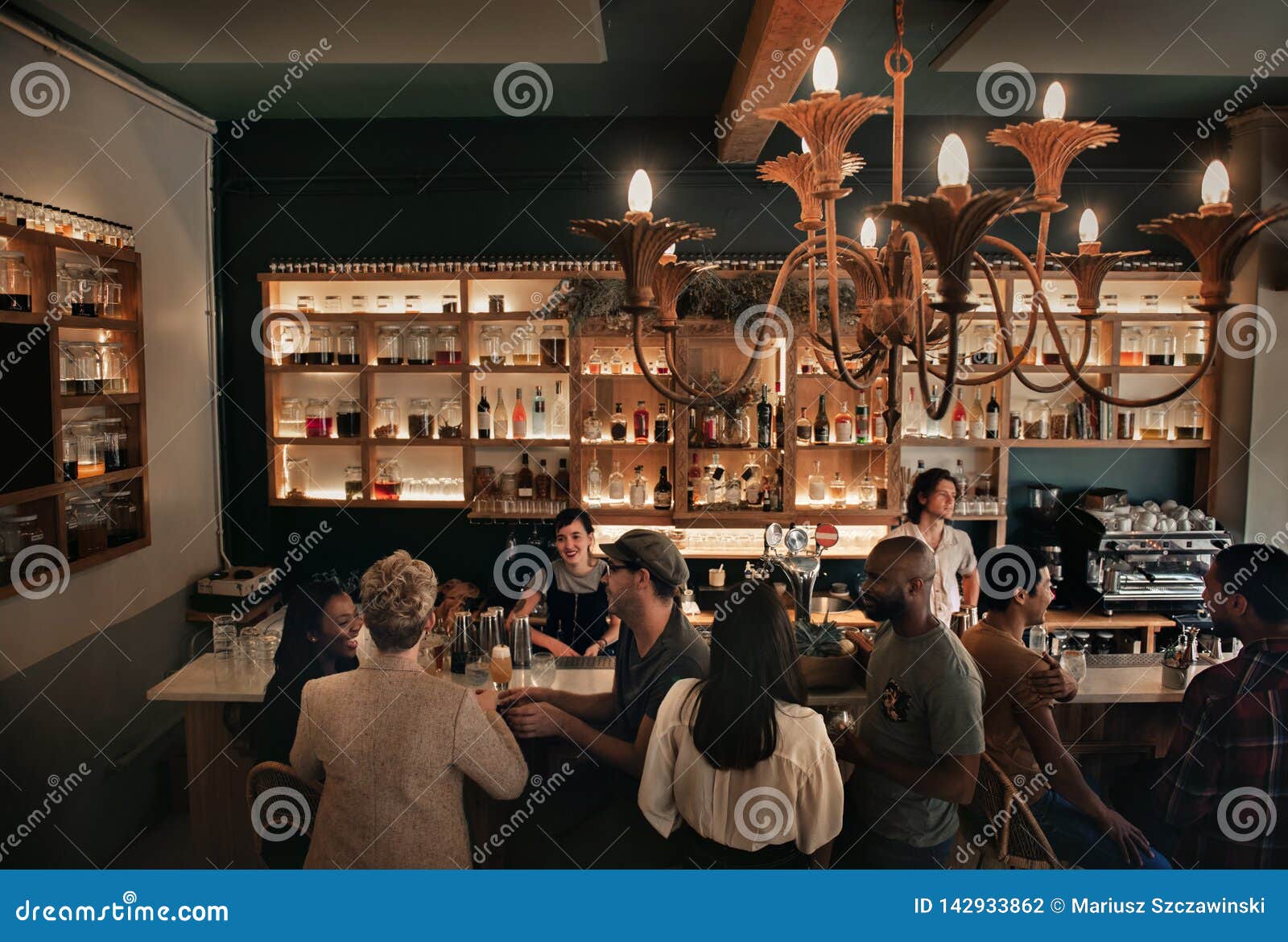 Diverse Group of People Enjoying a Night at the Pub Stock Photo - Image ...