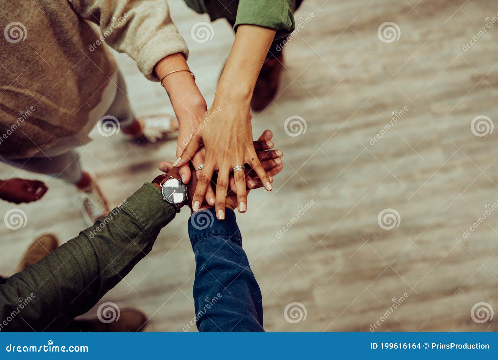 Diverse Group of People Gathering To Stack Hands Showing Unity and ...