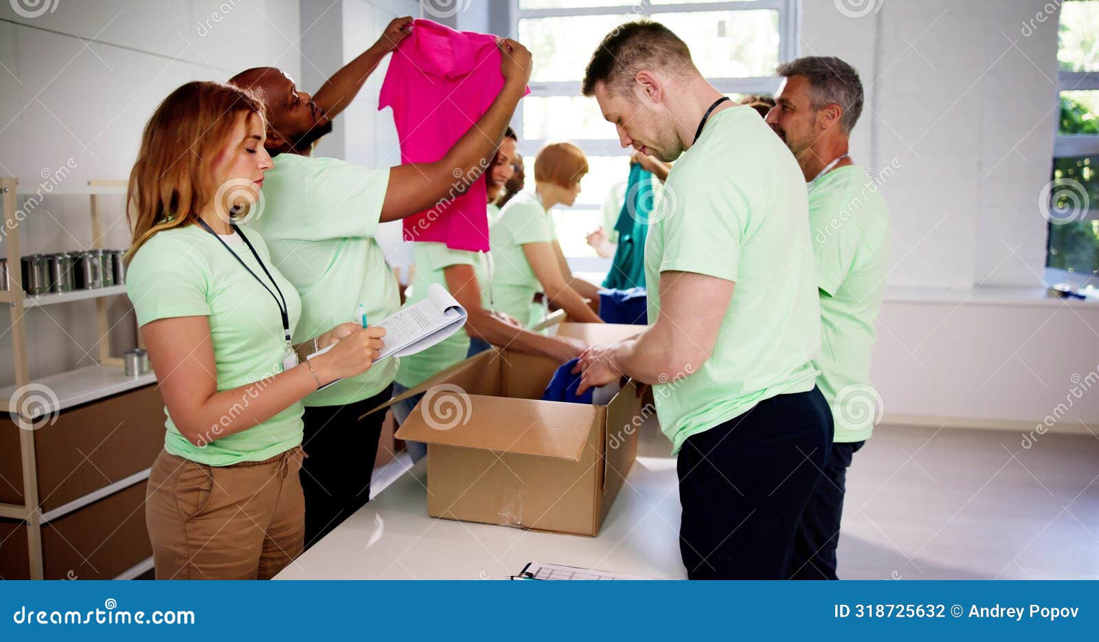 Diverse Group of People Sorting Clothes Stock Photo - Image of black ...