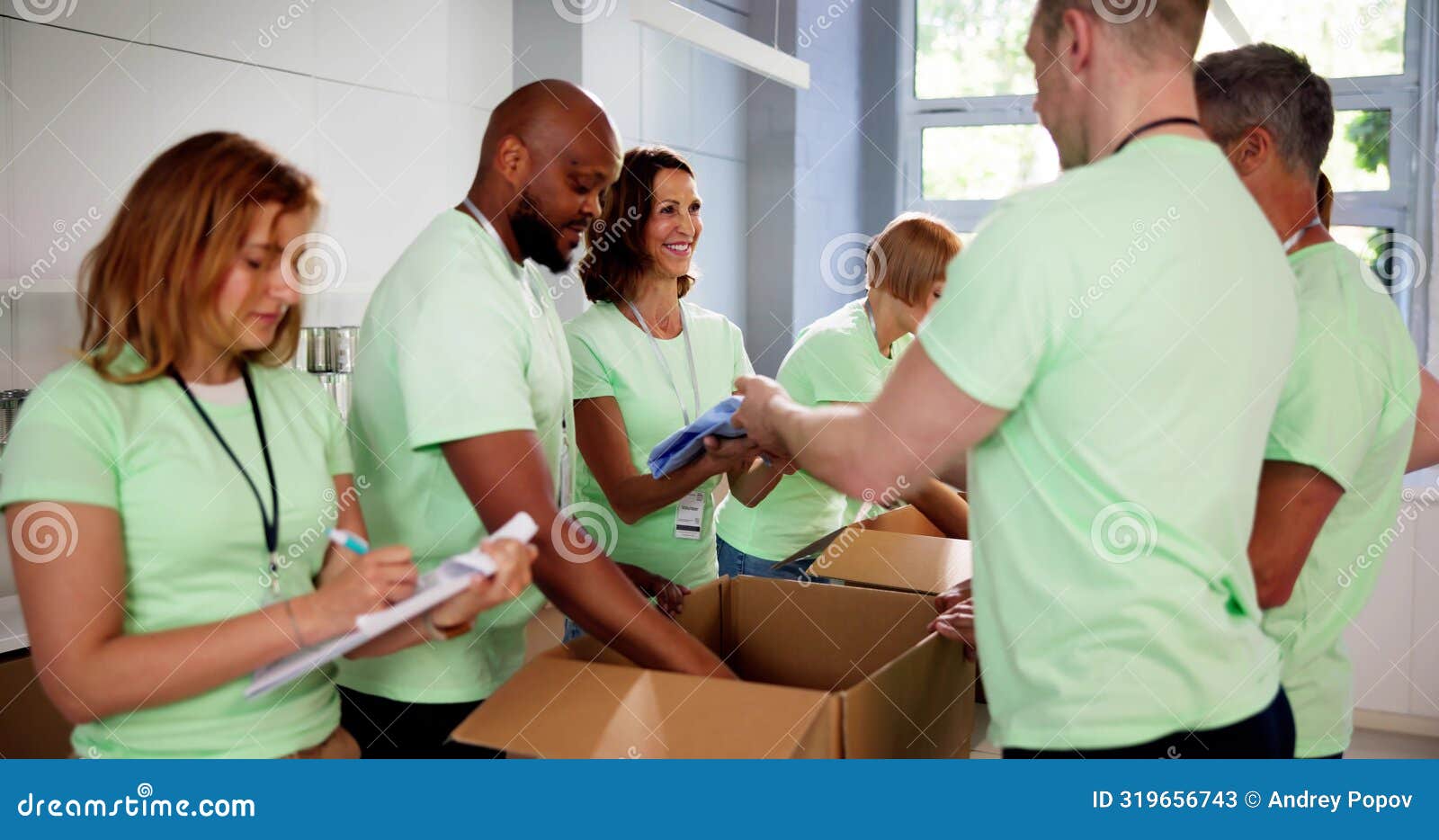 Diverse Group of People Sorting Clothes Stock Image - Image of young ...