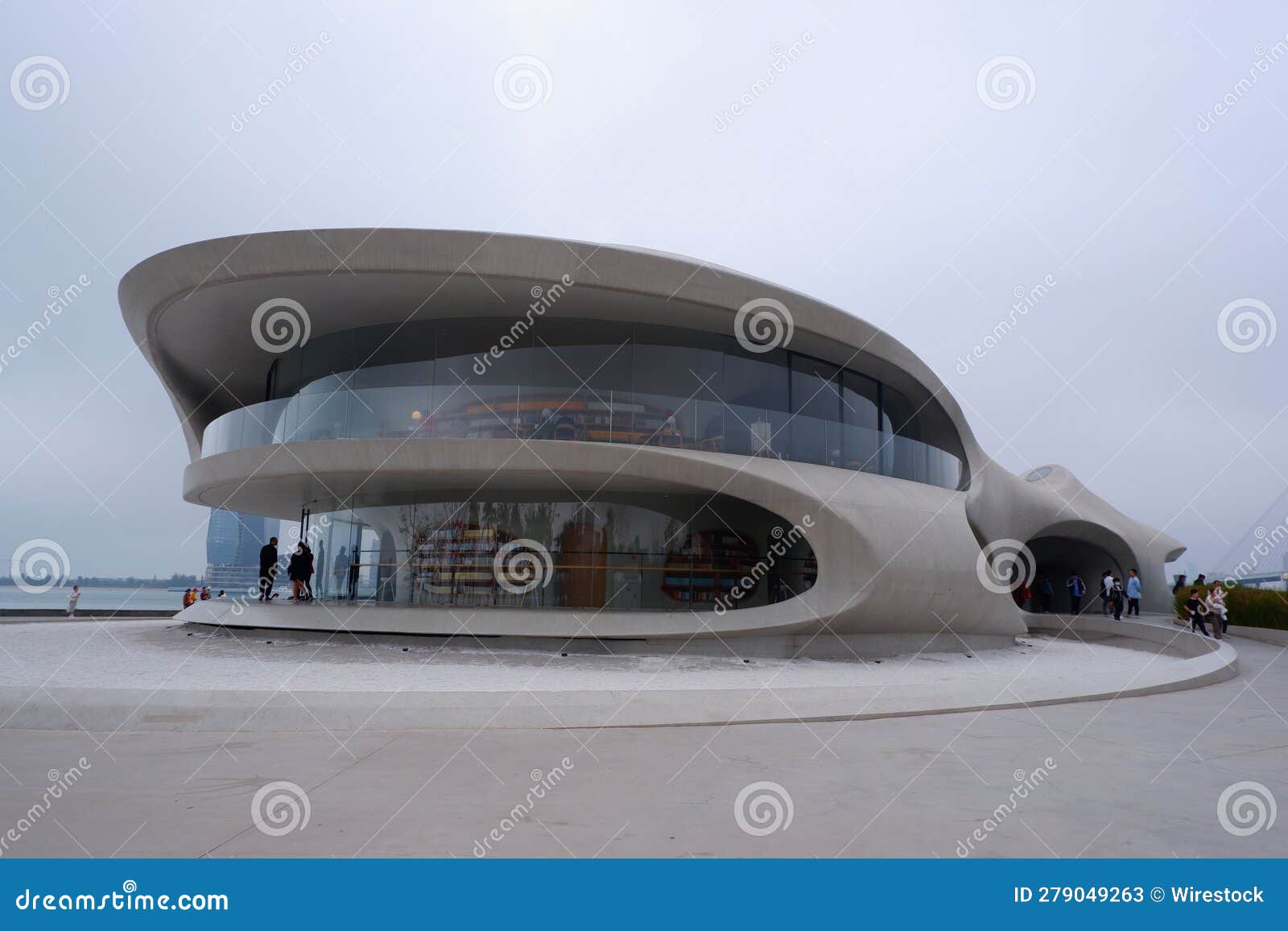 Diverse Group of People Standing in Front of the Wormhole Library in ...