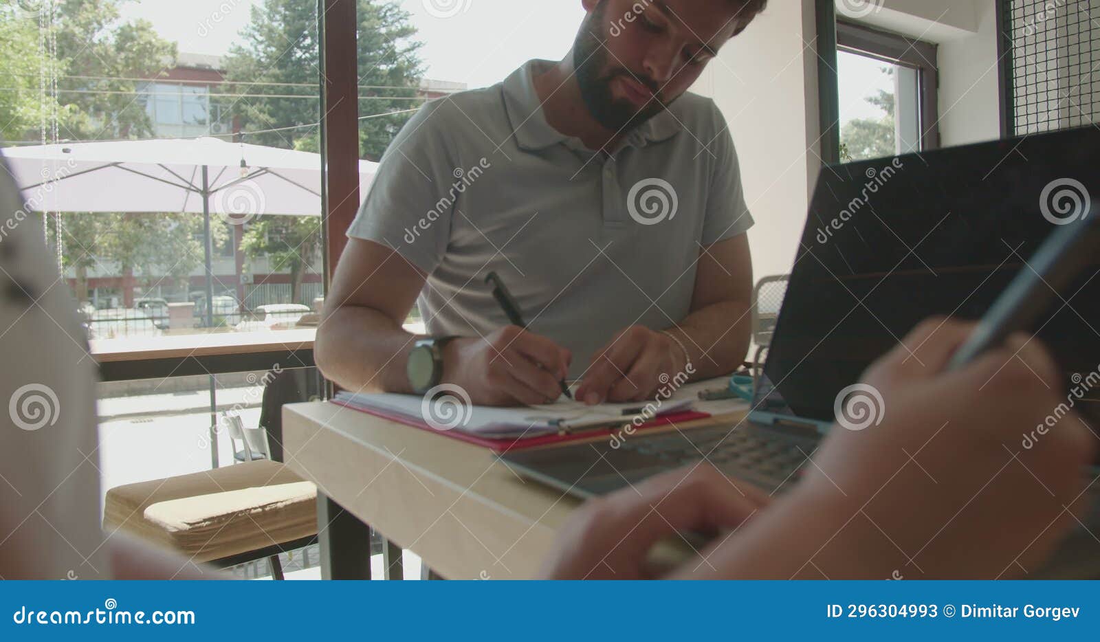 Diverse Group of People Working Together on a Project while Discussing ...