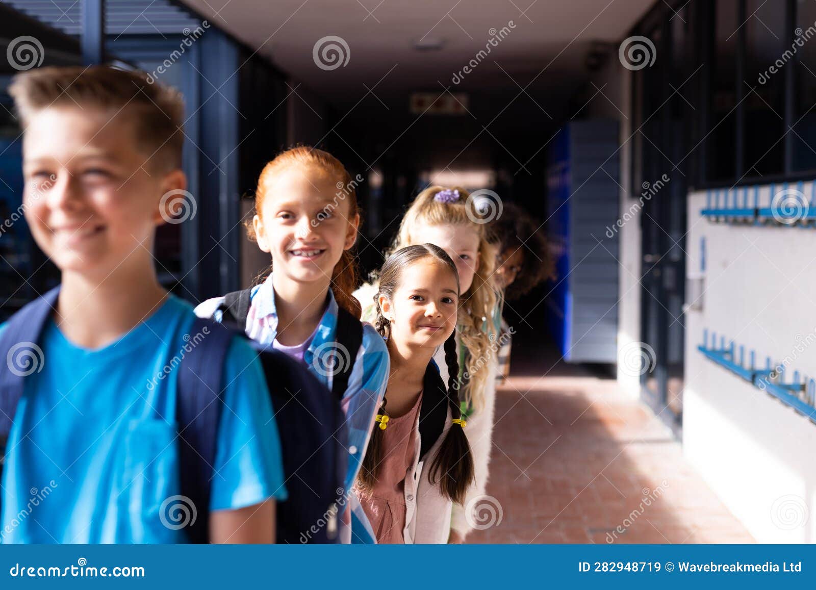 Diverse Group of Smiling Elementary Schoolchildren with Schoolbags ...