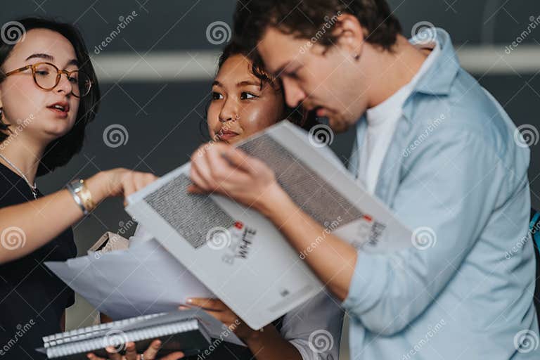 Students Discussing Plans with a Professor during Class Break Stock ...