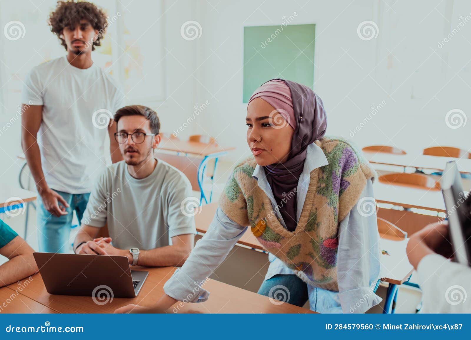 A Diverse Group of Students Gathers in a Modern School Classroom ...