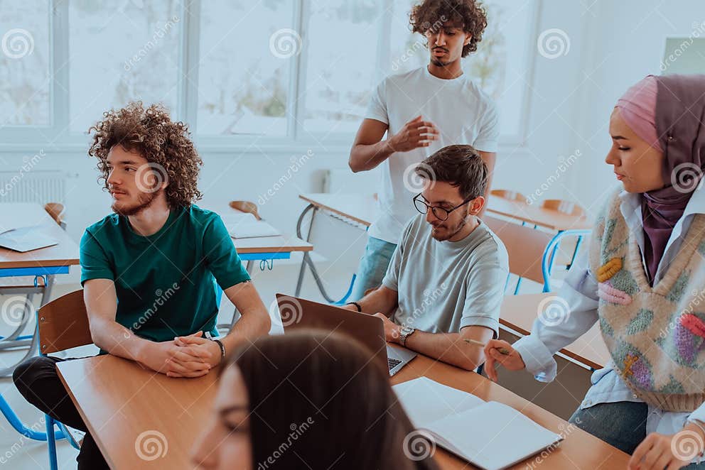 A Diverse Group of Students Gathers in a Modern School Classroom ...