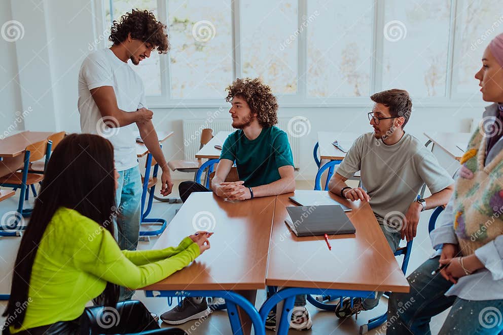 A Diverse Group of Students Gathers in a Modern School Classroom ...