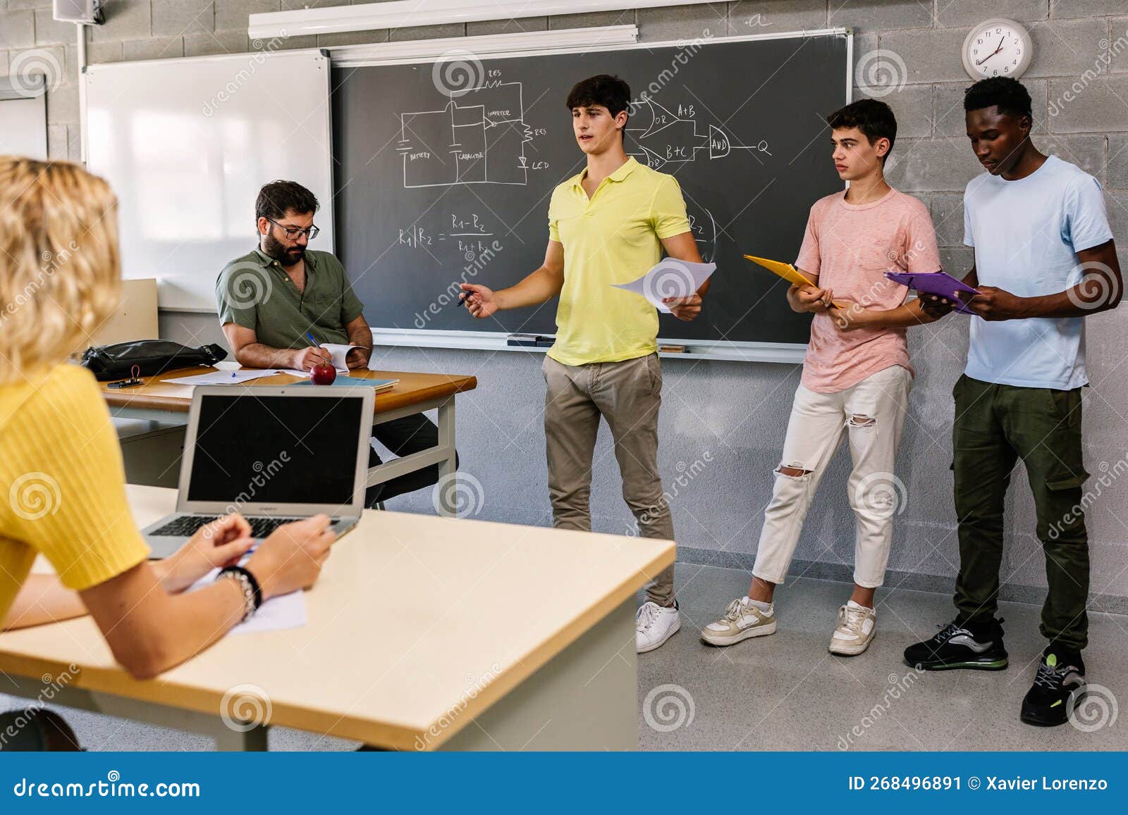 Diverse Group of Three Young Male Students Teaching Personal Project at ...