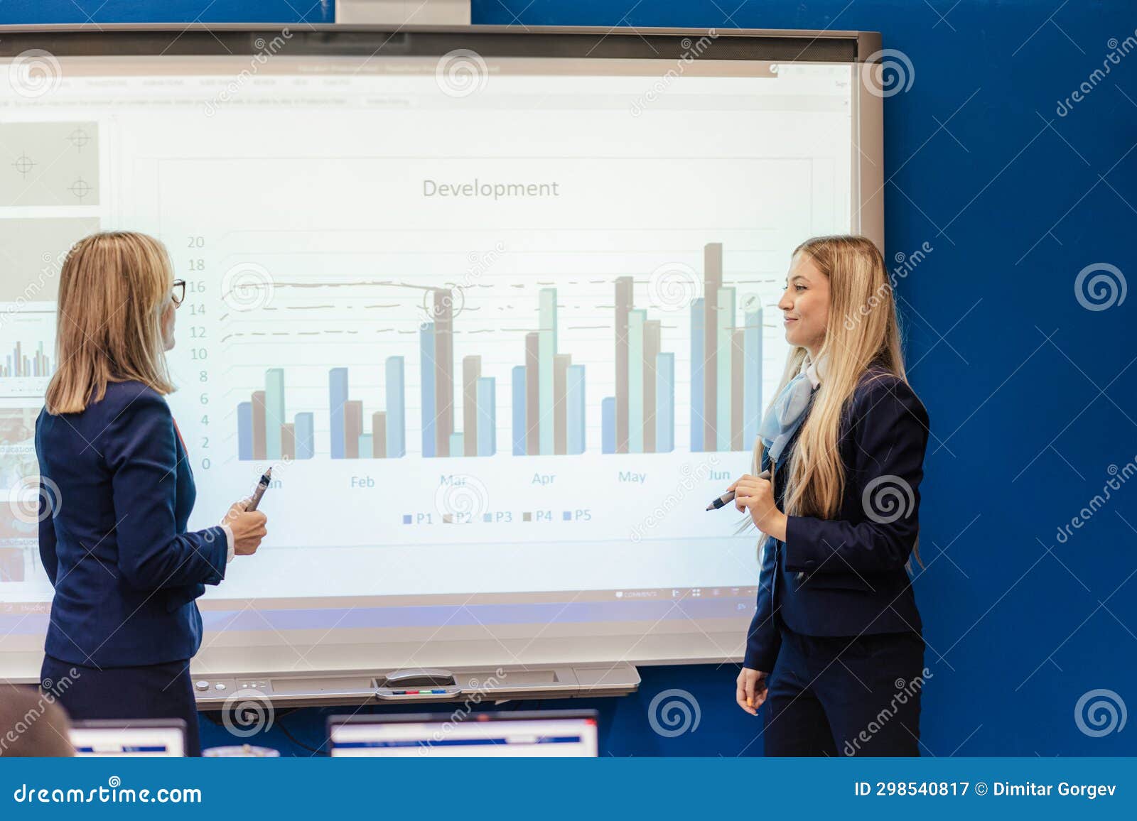 A Diverse Group of University Students Collaborating on a Project ...