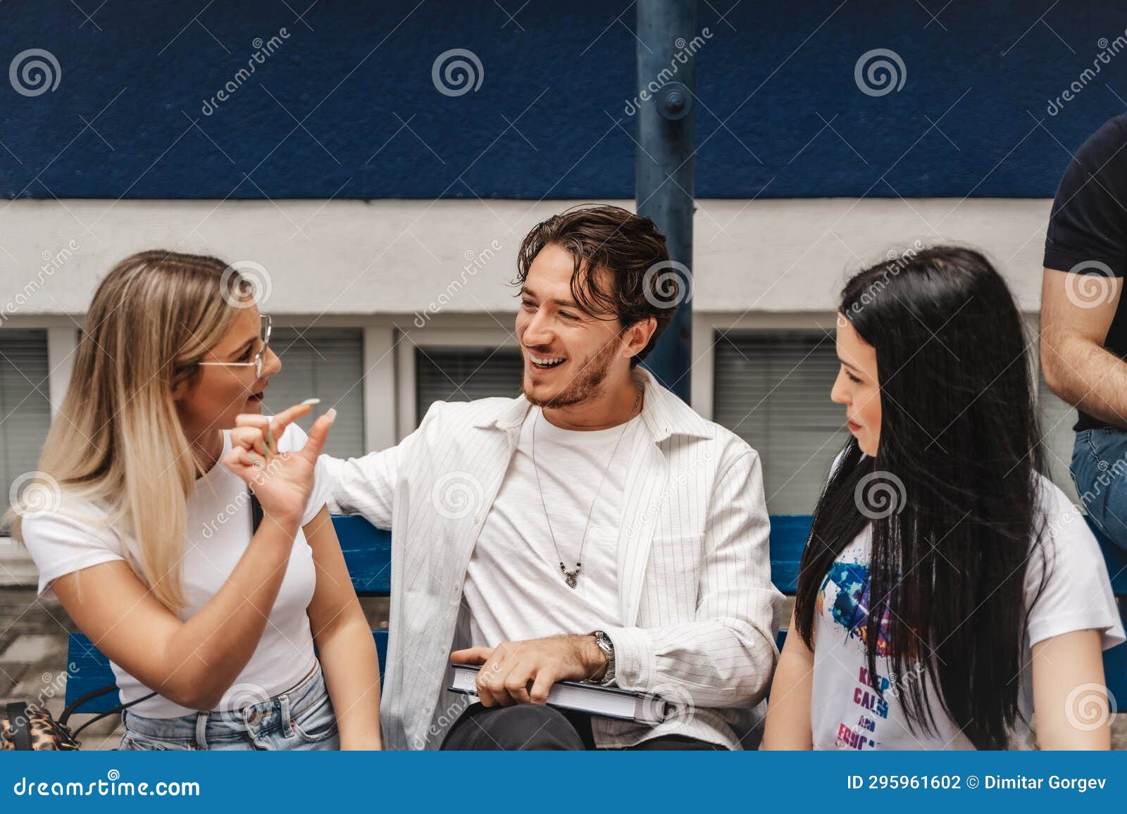 A Diverse Group of University Students Having a Discussion and ...