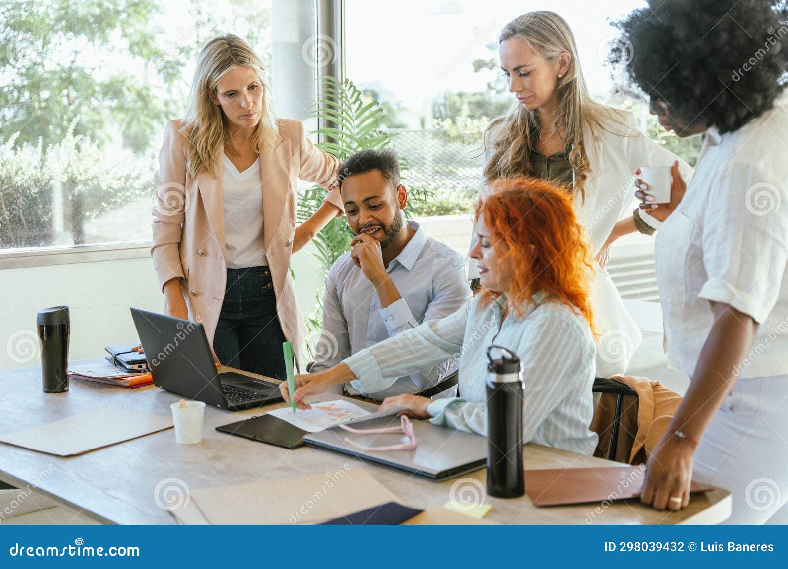 Diverse Group of Work Colleagues Planning a Strategy for a Work Project ...