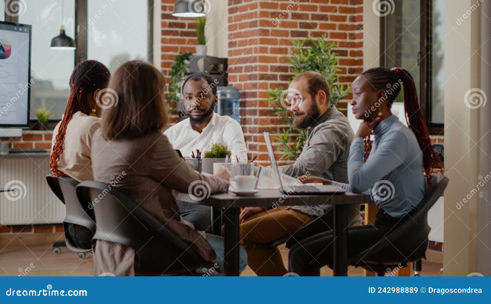 Diverse Group of Workmates Talking about Project Planning Stock Image ...