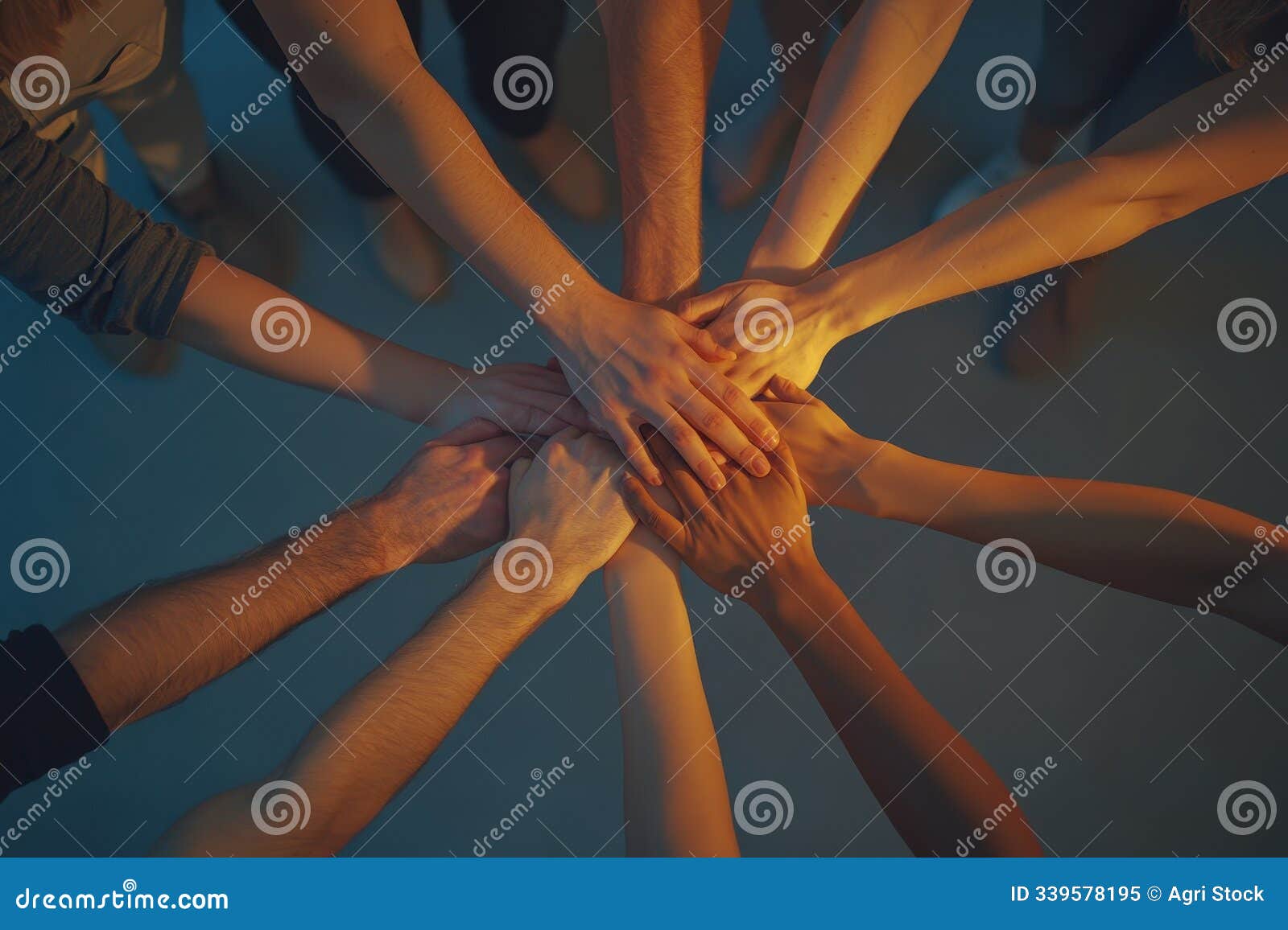 Diverse Hands Interlocked in a Circle, Demonstrating Unity and Teamwork ...