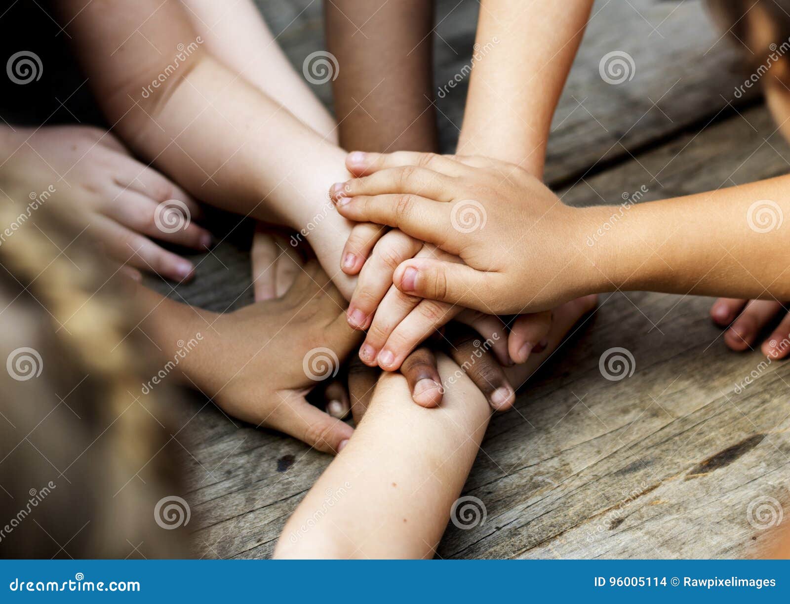 Diverse Hands are Join Together on the Wooden Table Stock Photo - Image ...