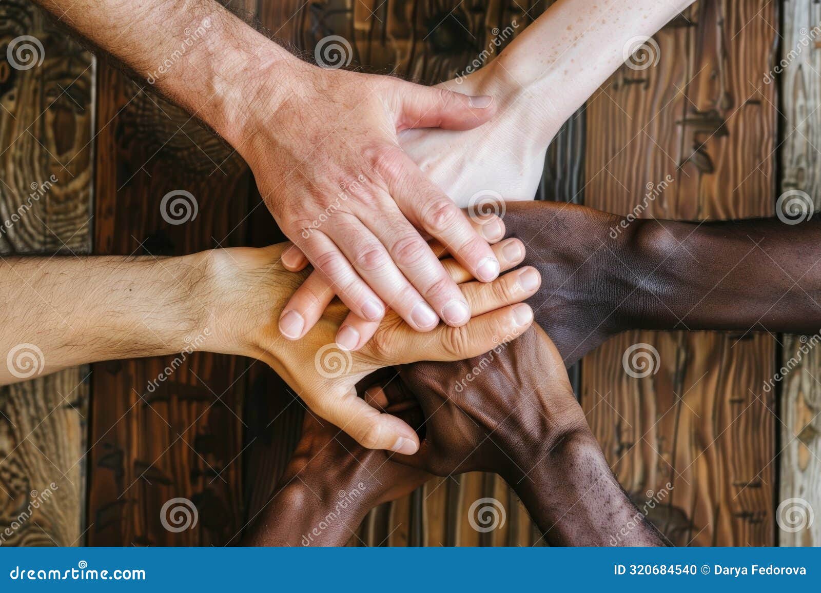 Diverse Hands Joined Together in Unity and Teamwork Stock Photo - Image ...