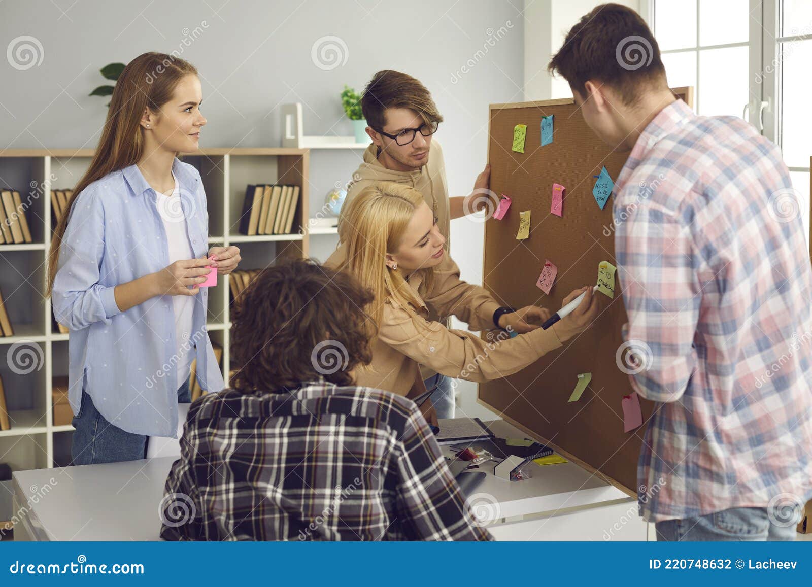 Diverse Highschool or College Student Group Discussing Project in Class ...