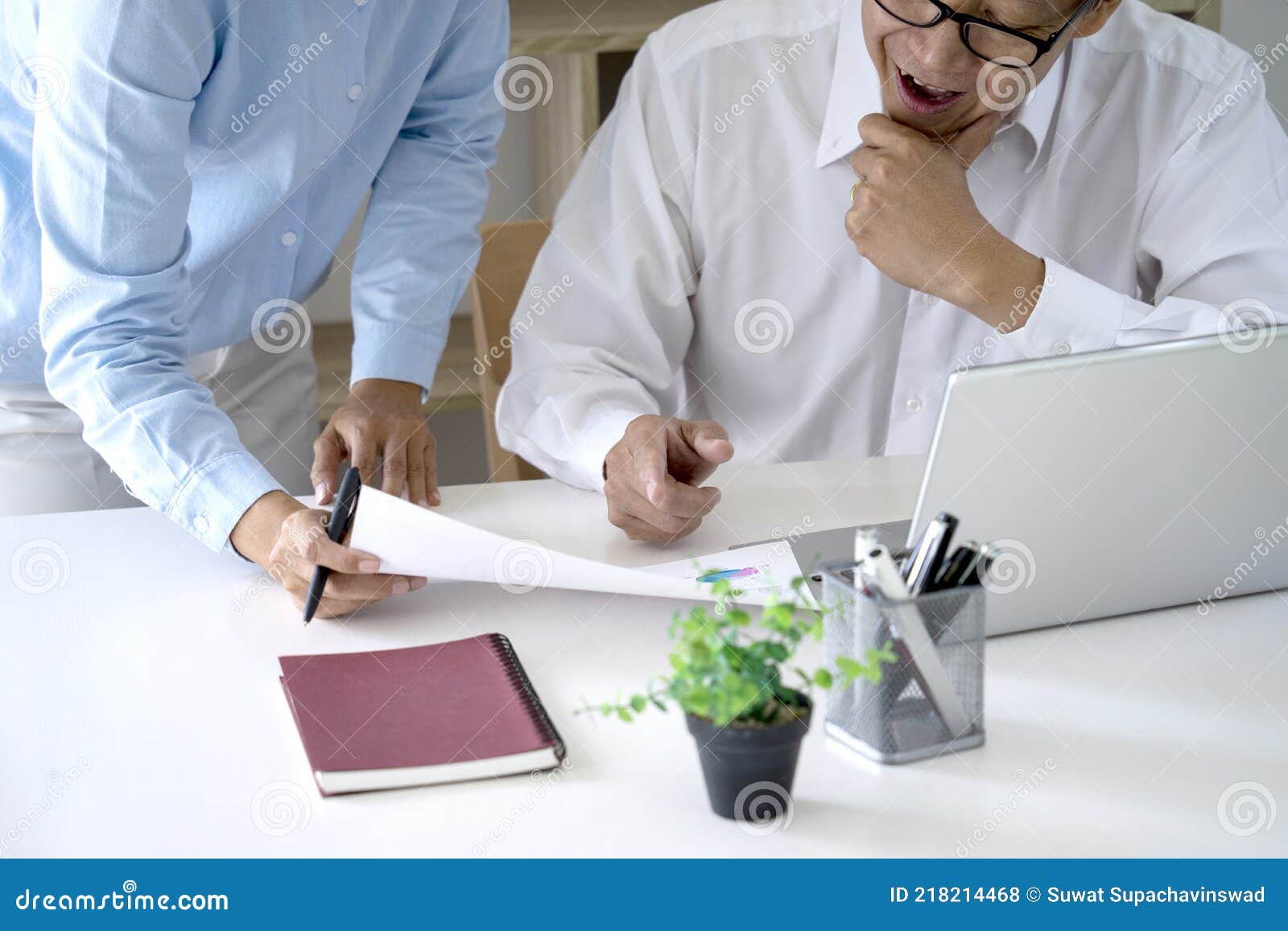 Diverse Male Mentor and Intern Talking Pointing on Paper Stock Photo ...
