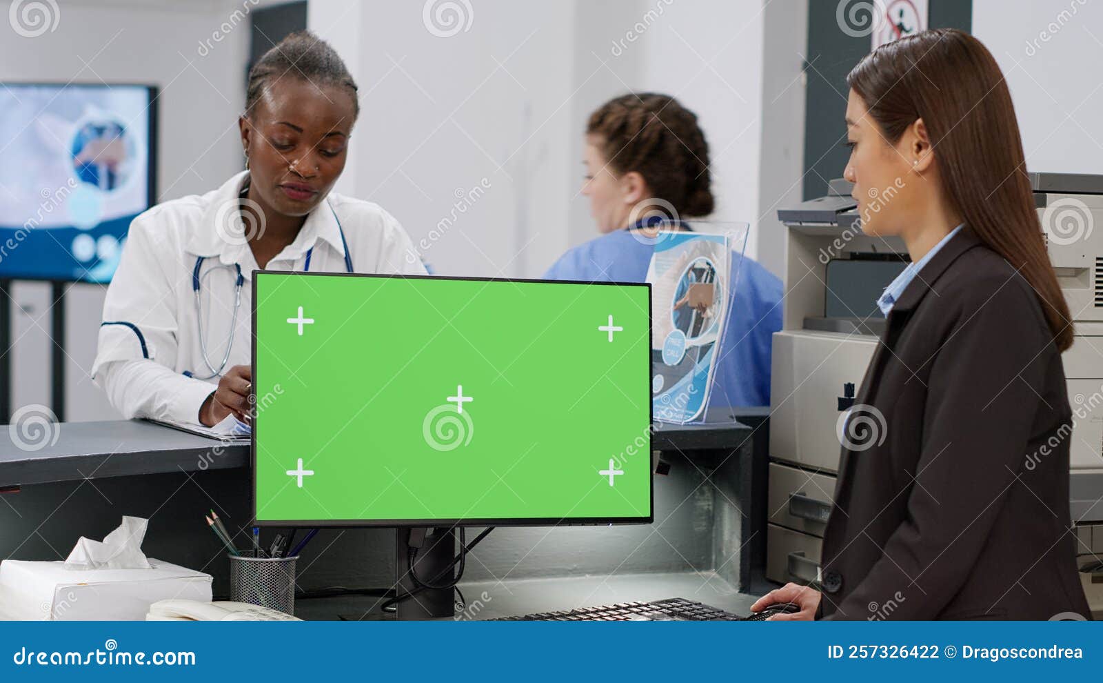 Diverse Medical Team Using Computer with Greenscreen Stock Photo ...