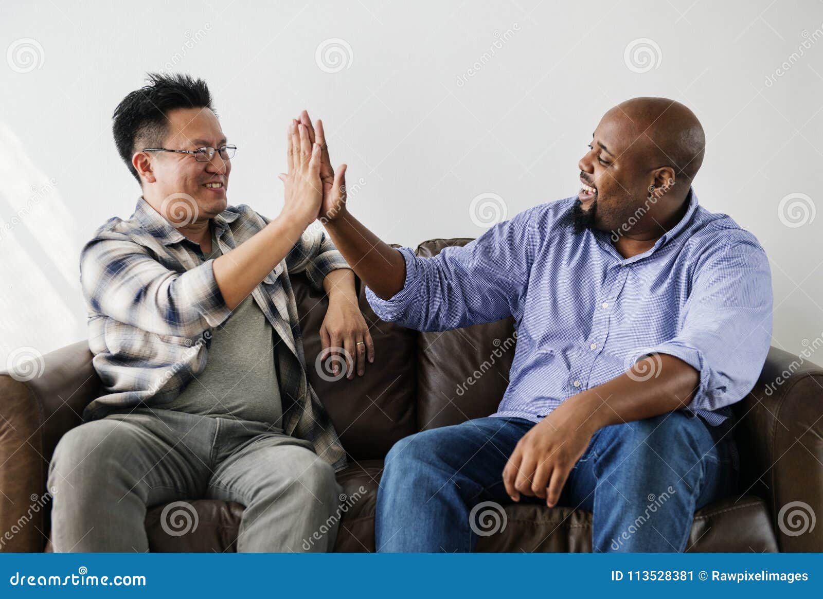 Diverse Men Joining Hands Together Stock Image - Image of african ...