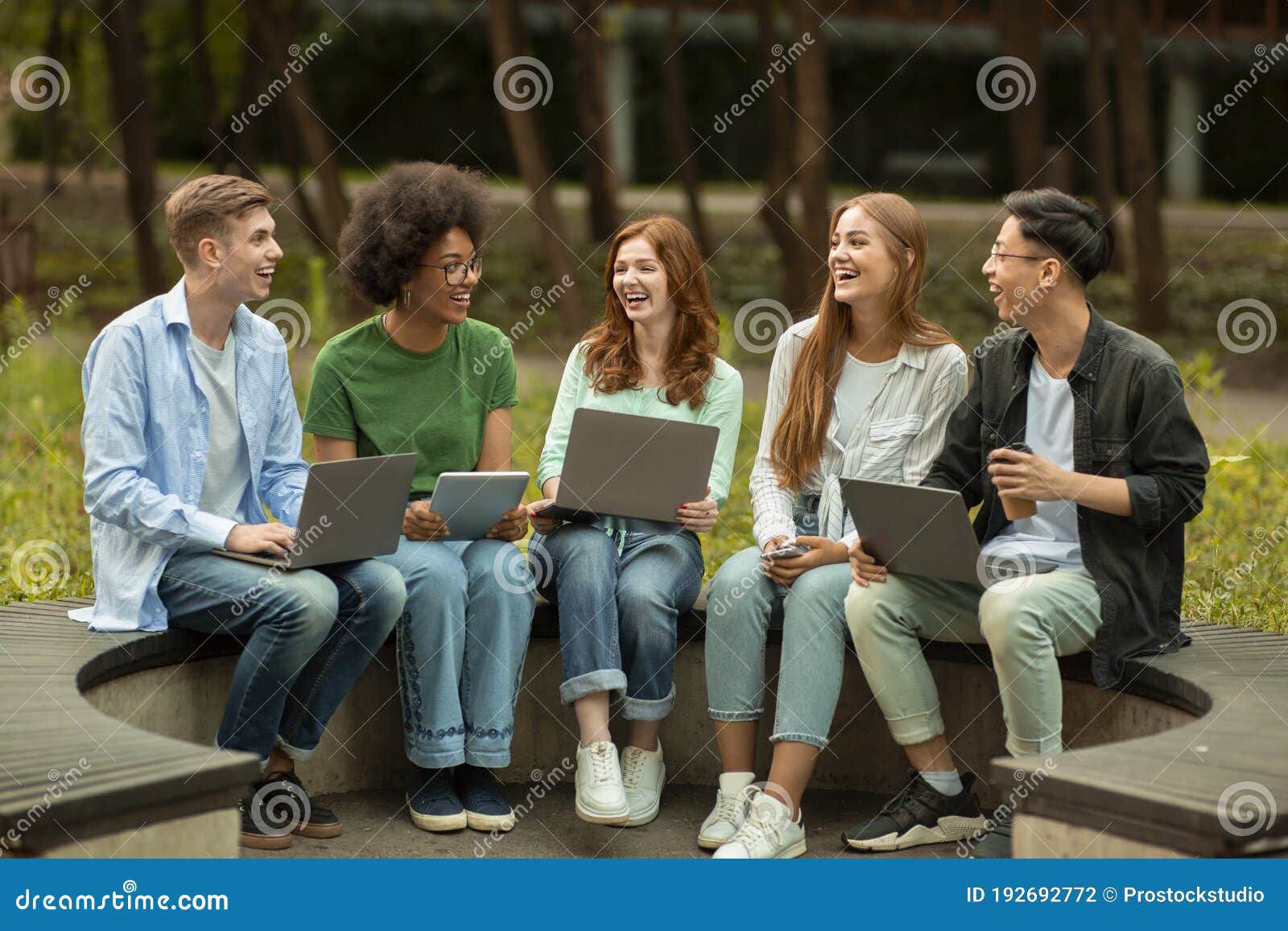 Diverse Multicultural Students Studying Outdoors with Different ...