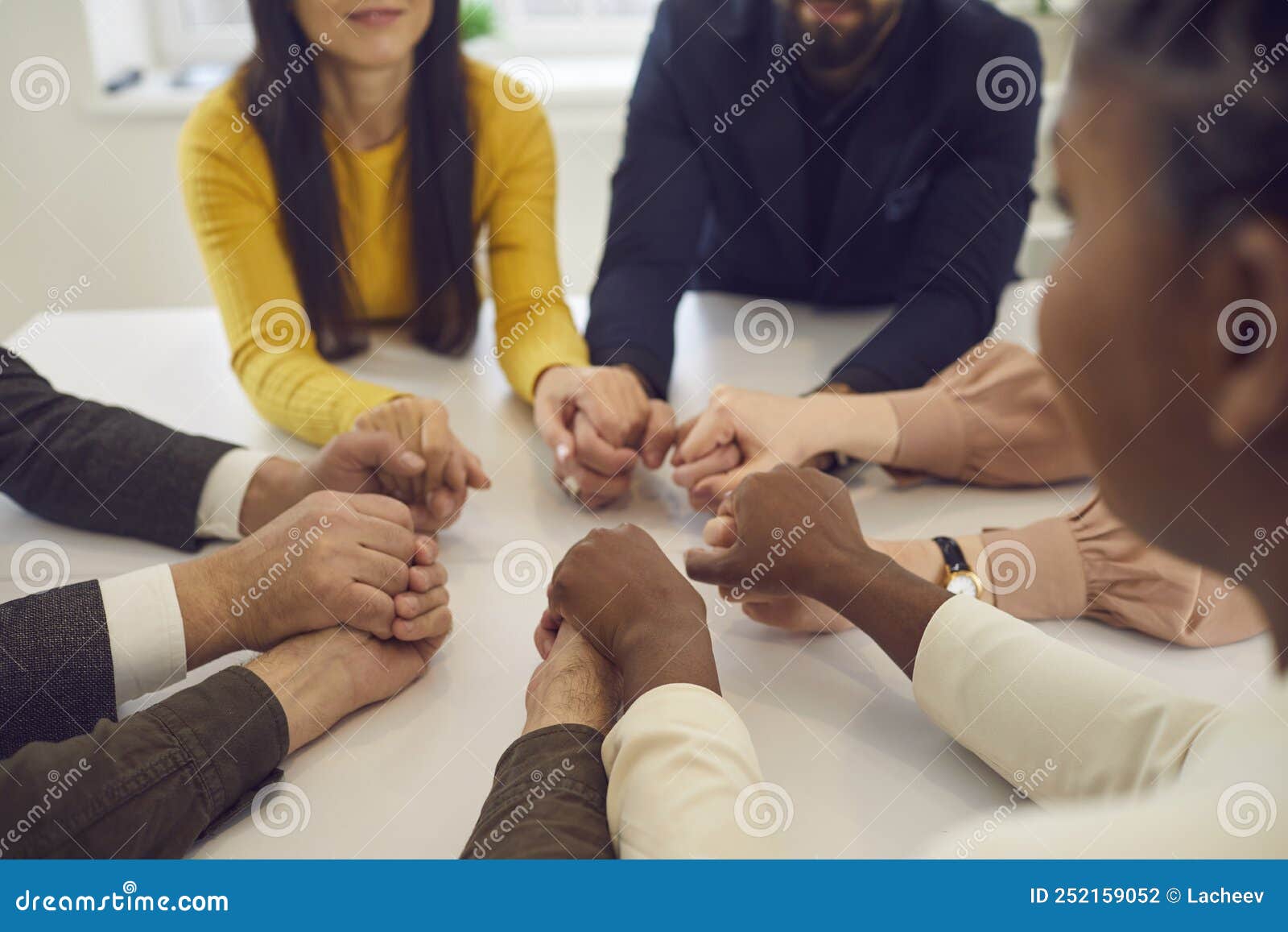 Diverse Multiracial Team of People Sitting Together Around a Table and ...