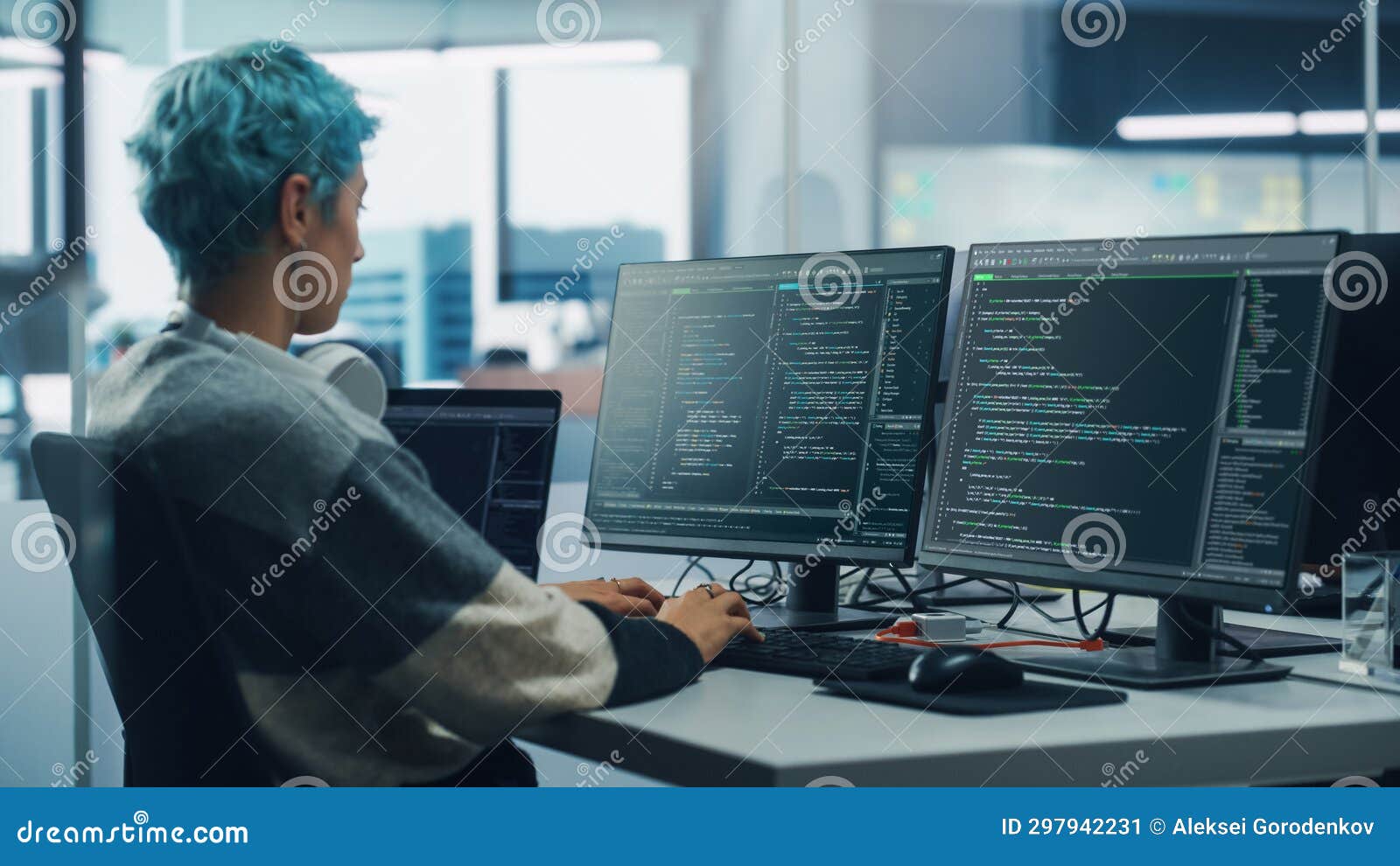 In Diverse Office: Female Programmer is Working on Desktop Computer ...