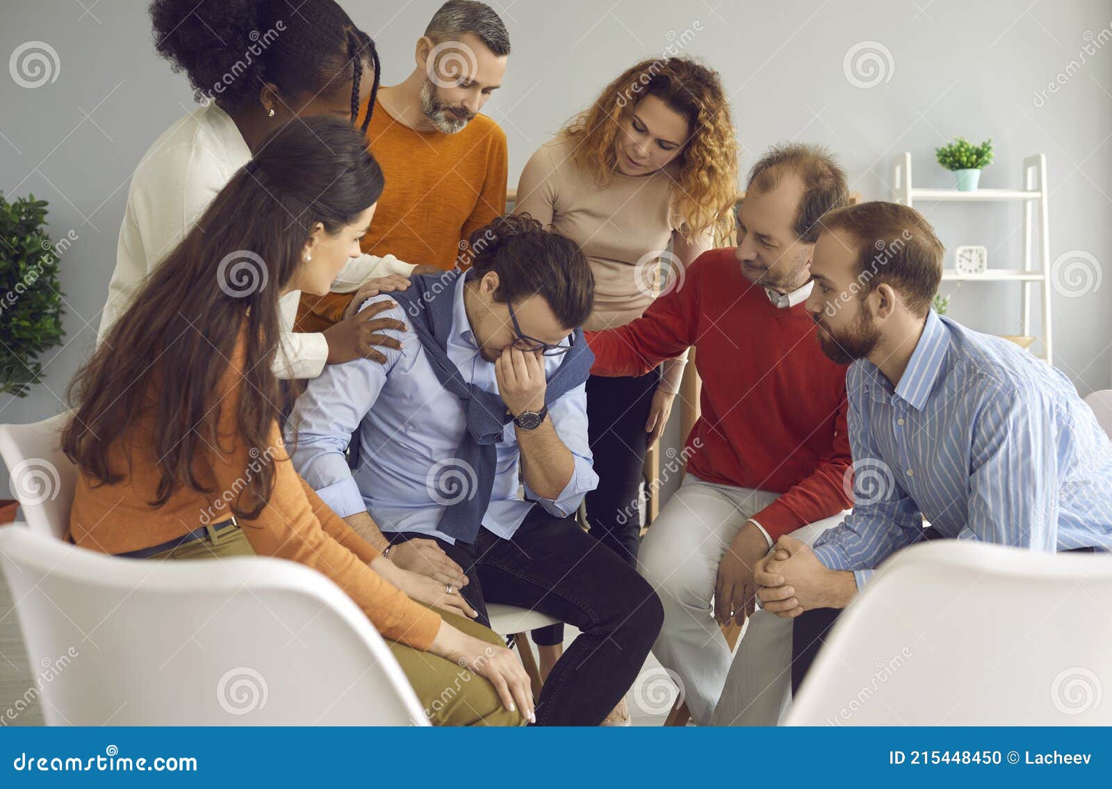Diverse People Comforting and Supporting Young Man Crying in Group ...