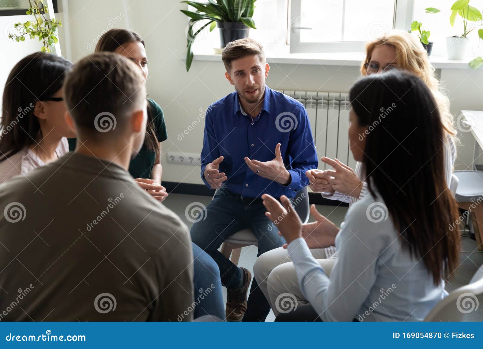 Diverse People Seated in Circle Participating at Group Therapy Session ...