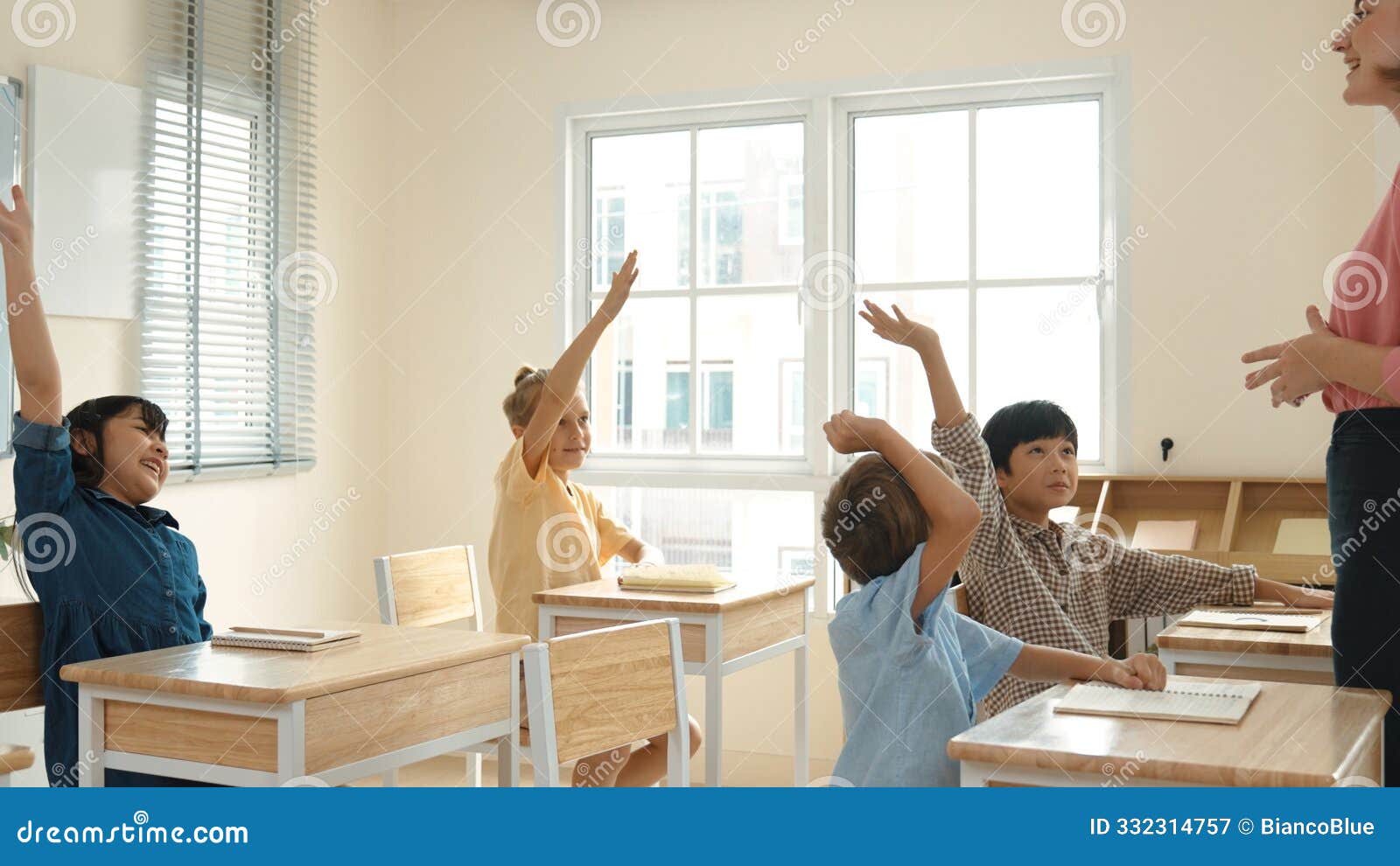 Diverse Smart Student Raised Hands To Answer Question at Classroom ...