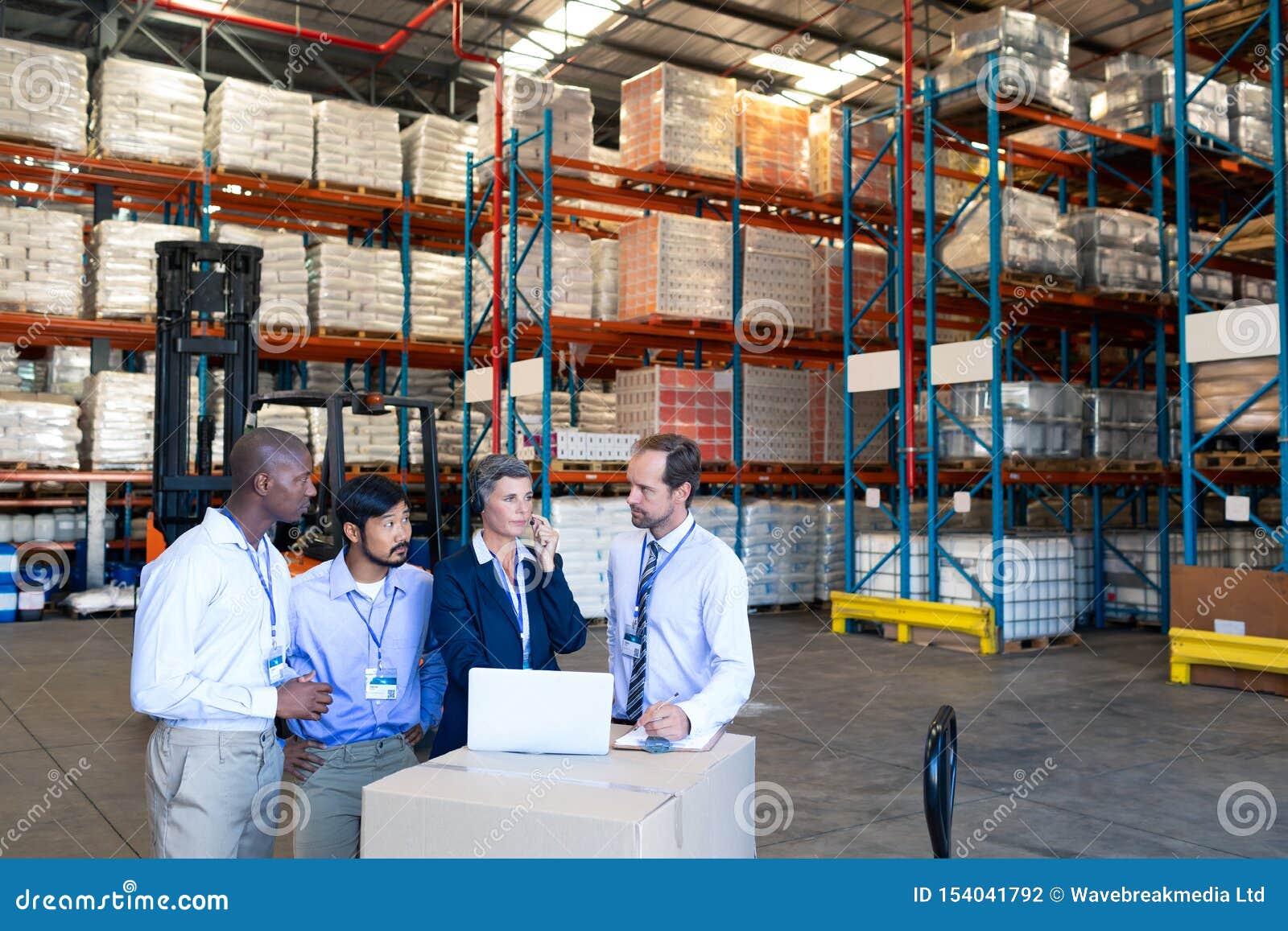 Diverse Staff Discussing with Each Other in Warehouse Stock Photo ...