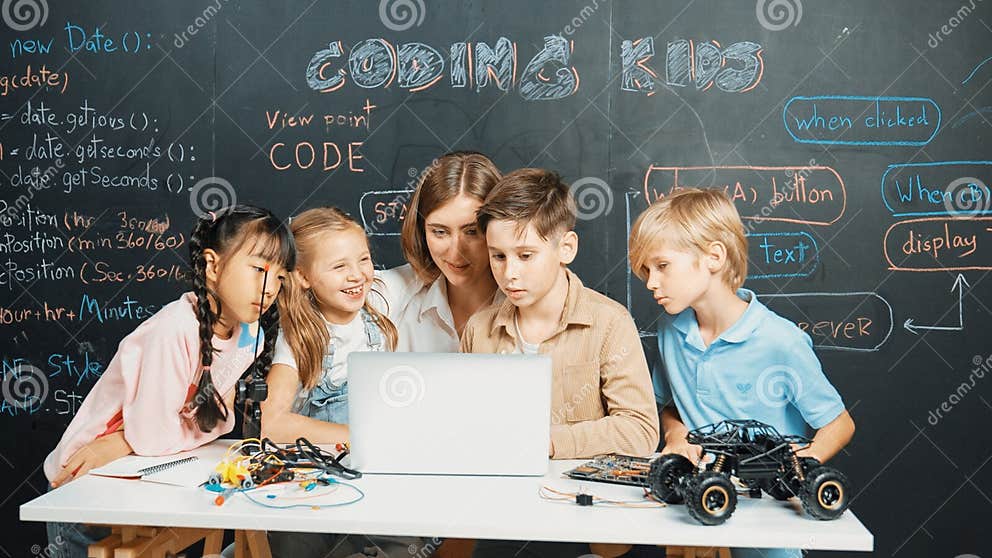 Diverse Student Writing Engineering Code while Boy Fixing Board. Erudition. Stock Photo - Image ...