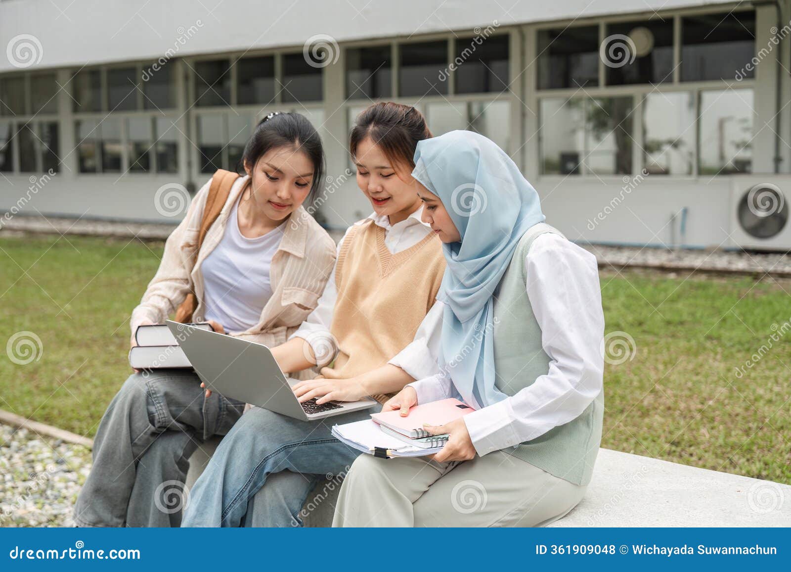 Diverse Students Collaborating with a Laptop and Study Materials ...