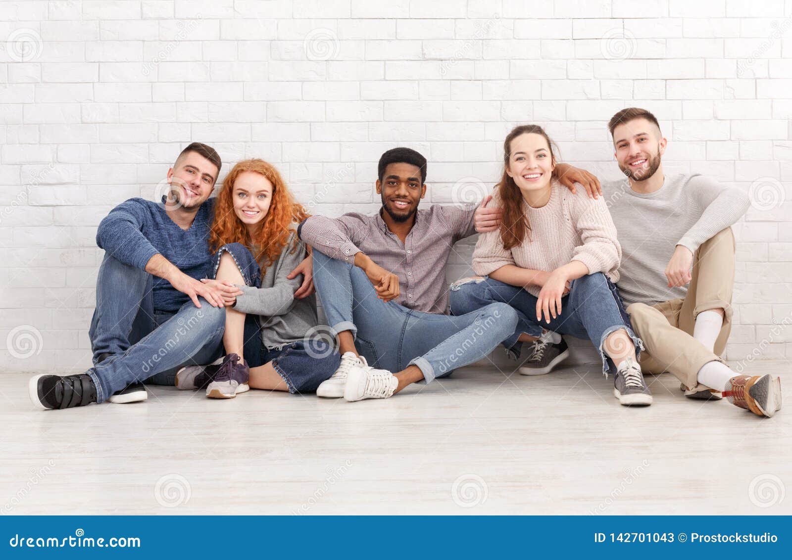 Diverse Students Sitting on Floor and Looking at Camera Stock Image ...