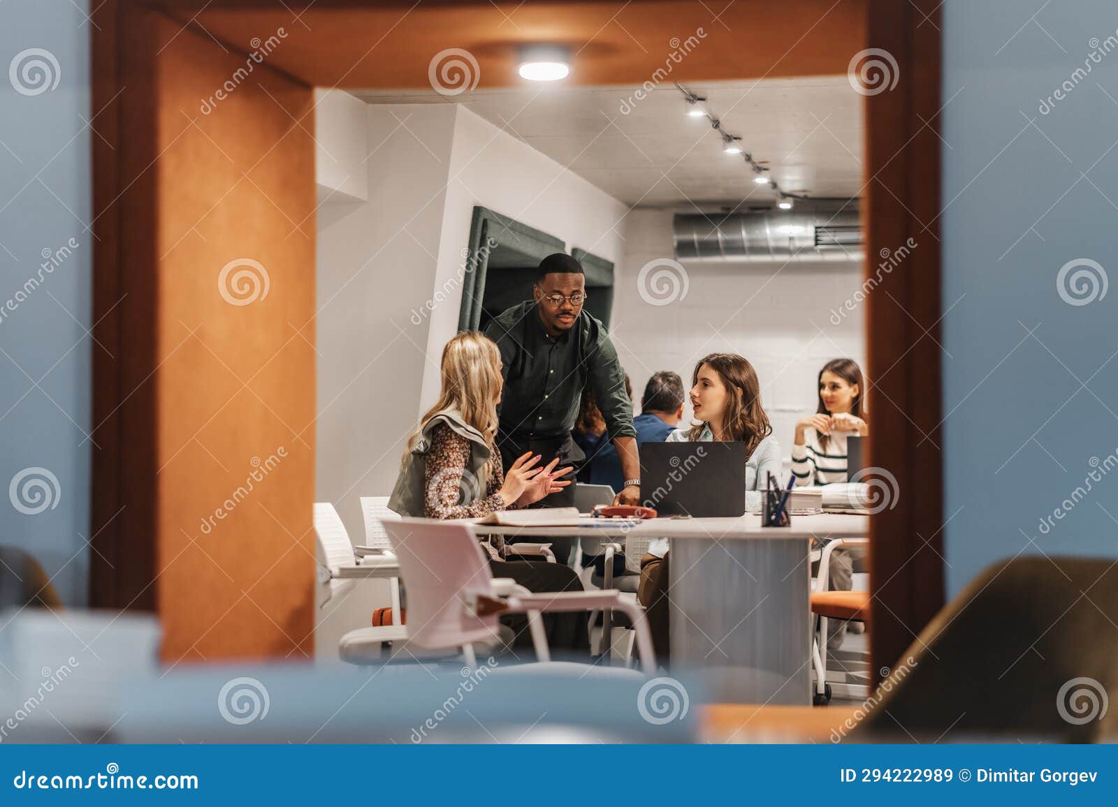 Diverse Team of People Discussing and Thinking about a Project in the ...