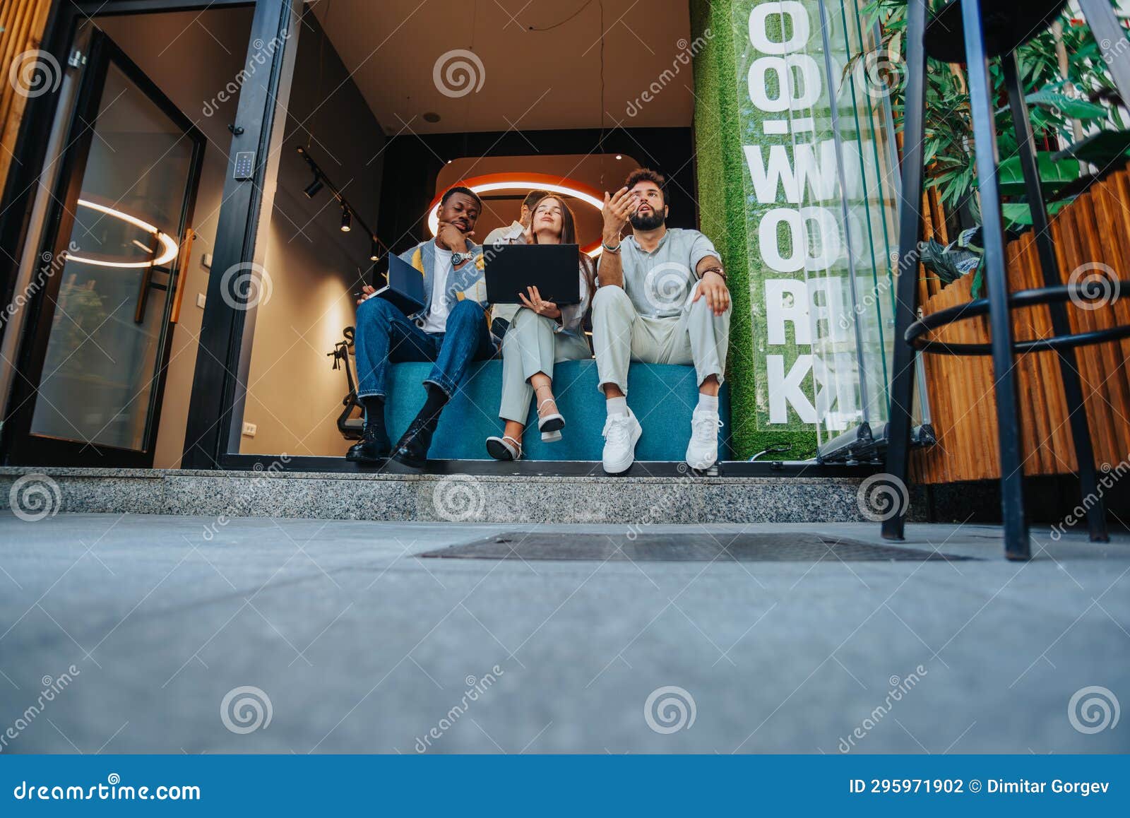 A Diverse Team of Professionals Collaborating in a Co-working Space ...