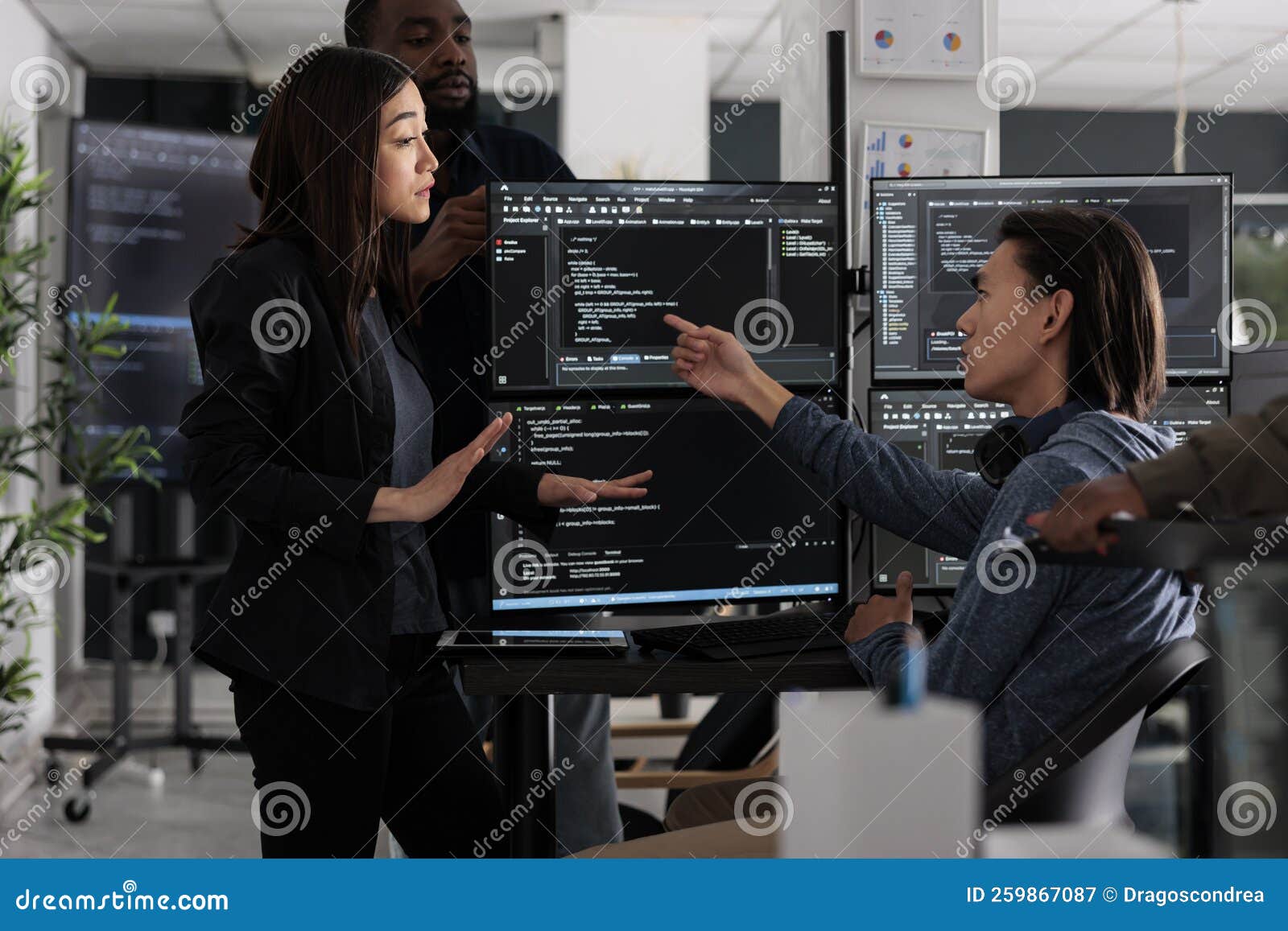 Diverse Team Of Programmers Coding Html Script Information On Computer At Desk Table Stock Image