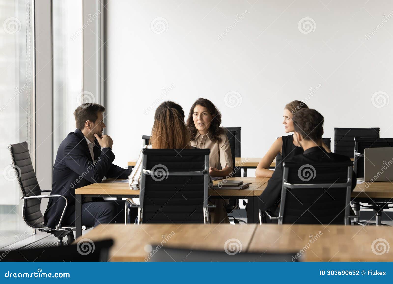Diverse Team of Serious Professional Colleagues Discussing Project ... Diverse Team of Serious Professional Colleagues Discussing Project ...