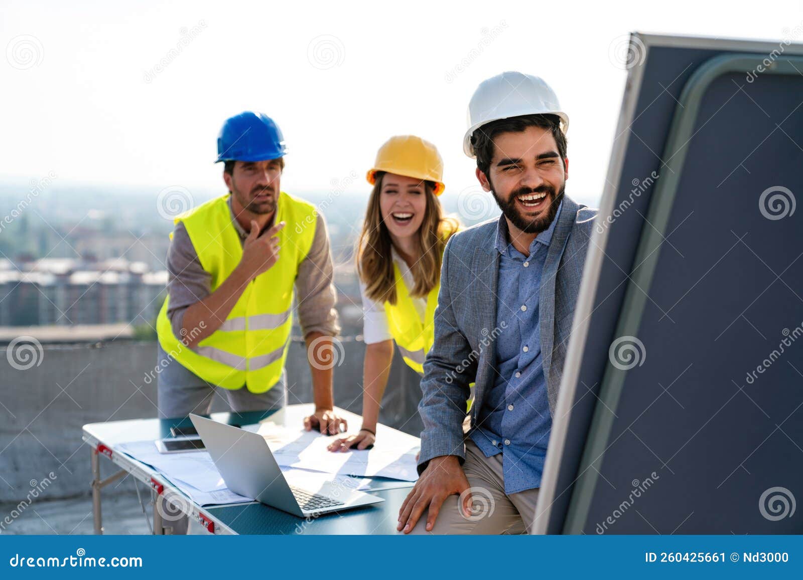 Diverse Team of Specialists with Computer on Construction Site ...