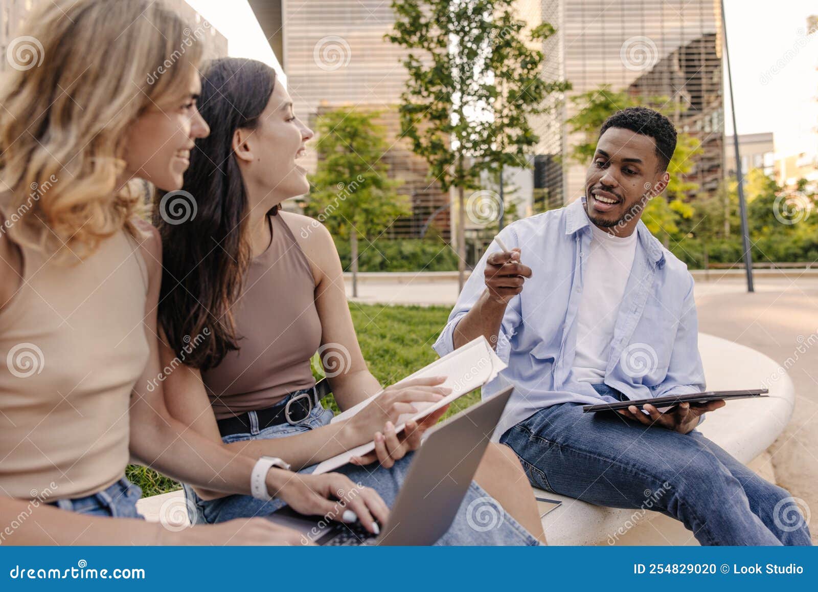 Diverse Young Classmates Having Fun Chatting and Using Modern ...