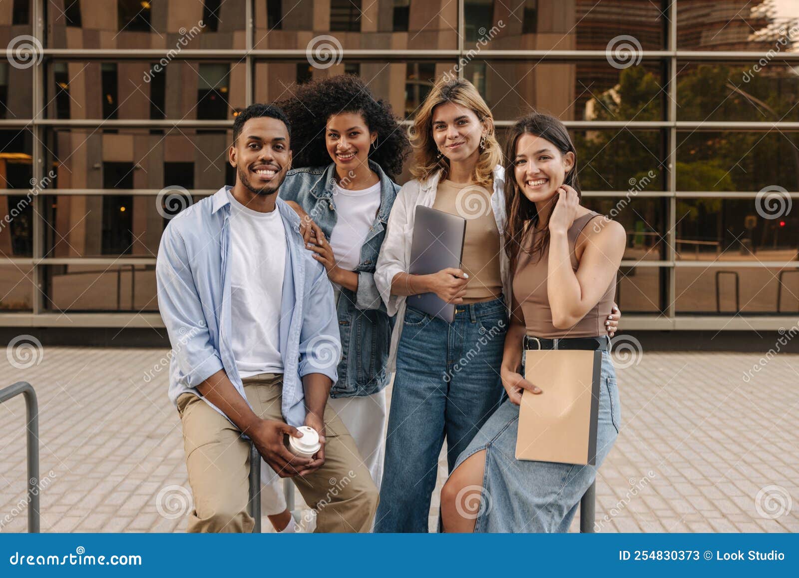 Diverse Young Classmates Walking after Class on Campus, Looking at ...
