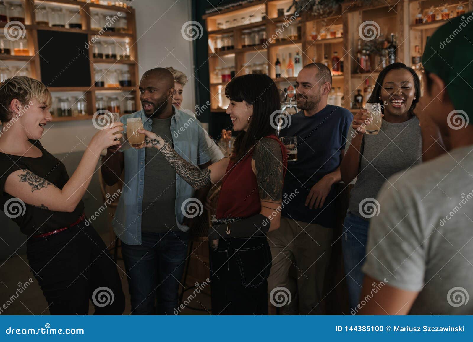 Diverse Young Friends Having Fun Together in a Bar Stock Photo - Image ...