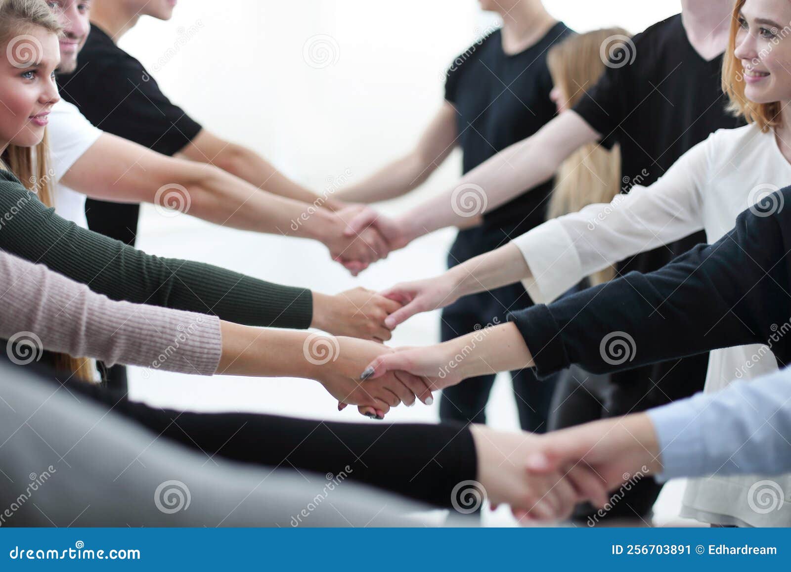 Diverse Young People Shaking Hands with Each Other Stock Image - Image ...