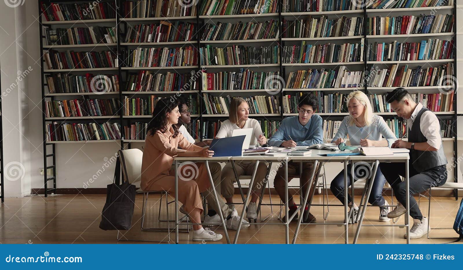 Diverse Young People Students Engaged in Self Study at Library Stock ...