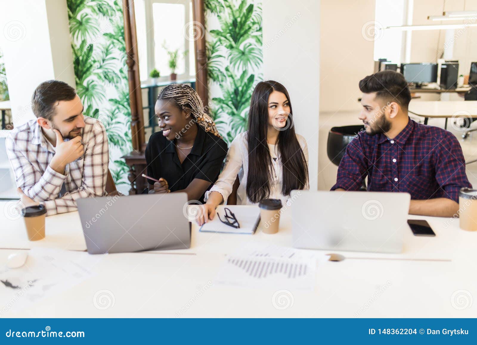 Diverse Young and Senior Office Workers Collaborating and Talking ...