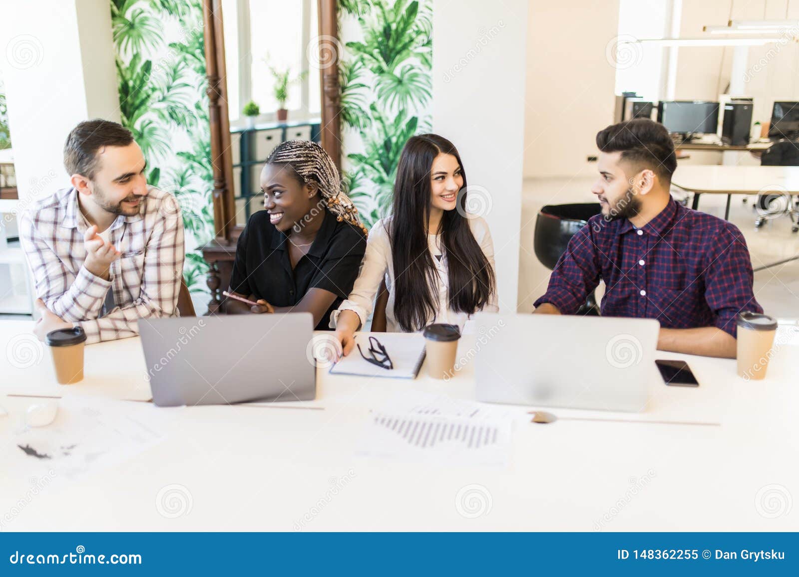 Diverse Young and Senior Office Workers Collaborating and Talking ...